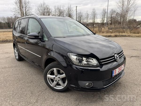 Melns Volkswagen Touran 2011 Ogre, ar dzinēja tilpumu 2.00 L un nobraukumu 222 tūkst. km par 7500 €, foto 1 vietnē AUTOMOTO.COM.LV