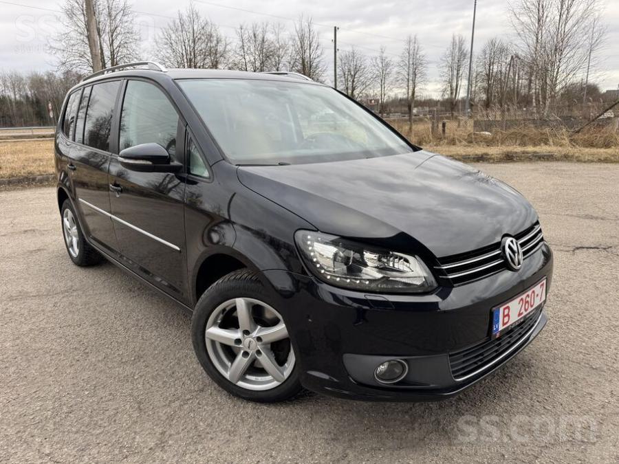 Melns Volkswagen Touran 2011 Ogre, ar dzinēja tilpumu 2.00 L un nobraukumu 222 tūkst. km par 7500 €, foto 1 vietnē AUTOMOTO.COM.LV