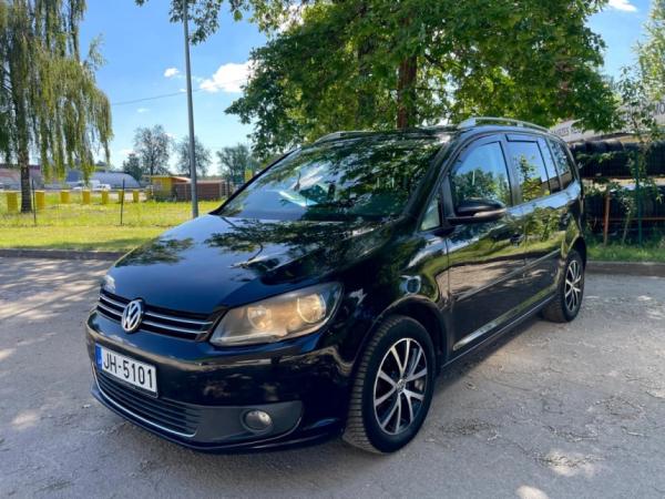 Black Volkswagen Touran 2011 in Riga, with an engine capacity of 1.60 L and mileage of 0 thousand km for 4800 €, photo 1 on AUTOMOTO.COM.LV