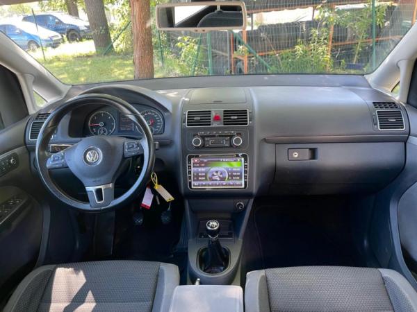Black Volkswagen Touran 2011 in Riga, with an engine capacity of 1.60 L and mileage of 0 thousand km for 4800 €, photo 7 on AUTOMOTO.COM.LV