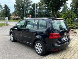 Black Volkswagen Touran 2011 in Riga, with an engine capacity of 1.60 L and mileage of 245 thousand km for 6950 €, photo 4 on AUTOMOTO.COM.LV