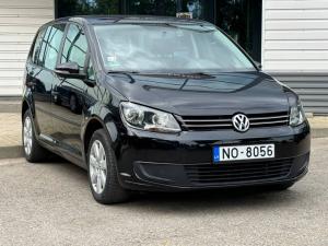 Black Volkswagen Touran 2011 in Riga, with an engine capacity of 1.60 L and mileage of 245 thousand km for 6950 €, photo 7 on AUTOMOTO.COM.LV