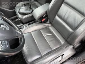 Black Volkswagen Touran 2011 in Ventspils, with an engine capacity of 2.00 L and mileage of 369 thousand km for 6499 €, photo 11 on AUTOMOTO.COM.LV