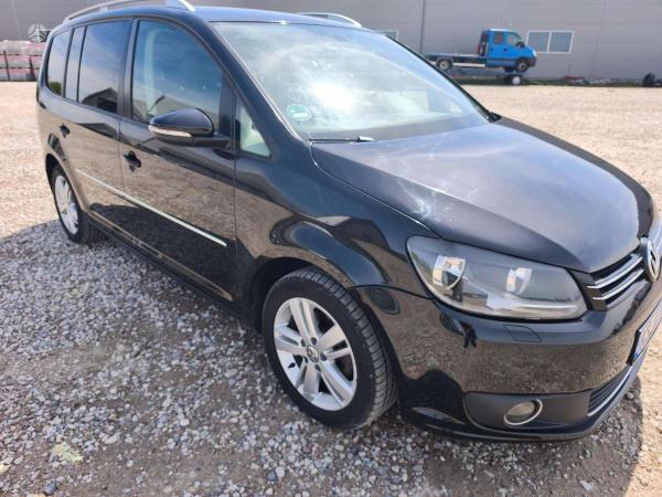 Black Volkswagen Touran 2011 in Marijampole, with an engine capacity of 1.60 L and mileage of 224 thousand km for 4390 €, photo 1 on AUTOMOTO.COM.LV