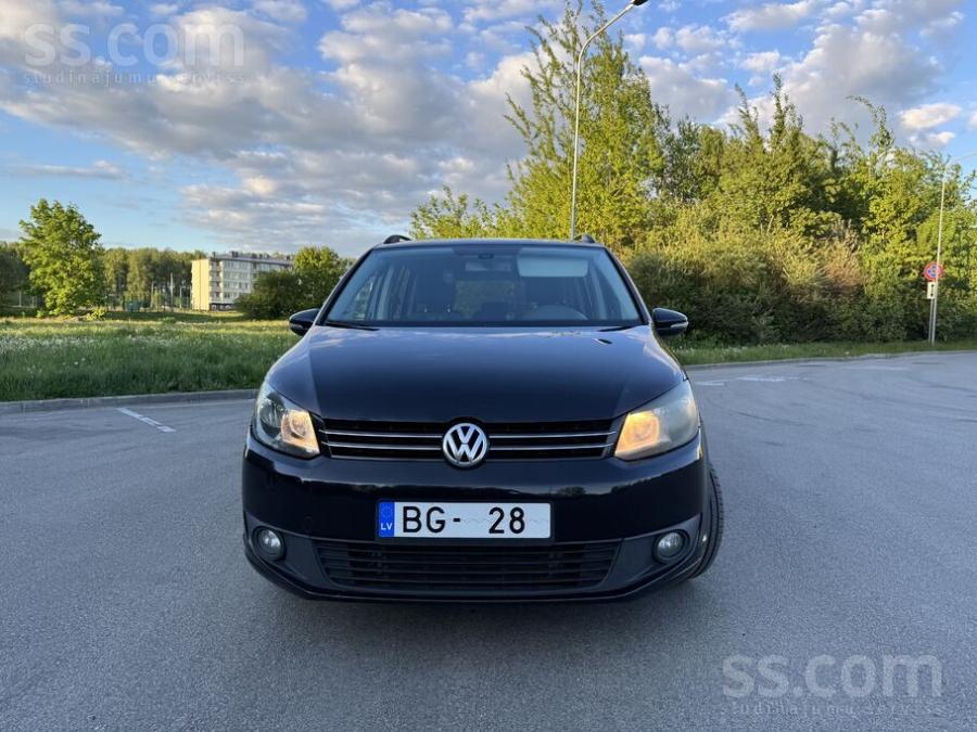 Black Volkswagen Touran 2012 in Riga, with an engine capacity of 2.00 L and mileage of 0 thousand km for 5100 €, photo 1 on AUTOMOTO.COM.LV