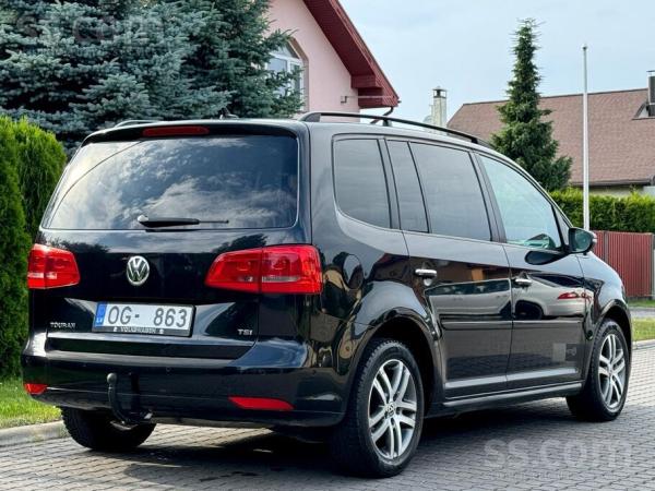 Melns Volkswagen Touran 2012 Rīga, ar dzinēja tilpumu 1.40 L un nobraukumu 244 tūkst. km par 6500 €, foto 7 vietnē AUTOMOTO.COM.LV
