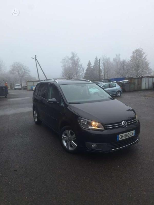 Black Volkswagen Touran 2012 in Vilnius, with an engine capacity of 1.97 L and mileage of 244 thousand km for 6650 €, photo 1 on AUTOMOTO.COM.LV