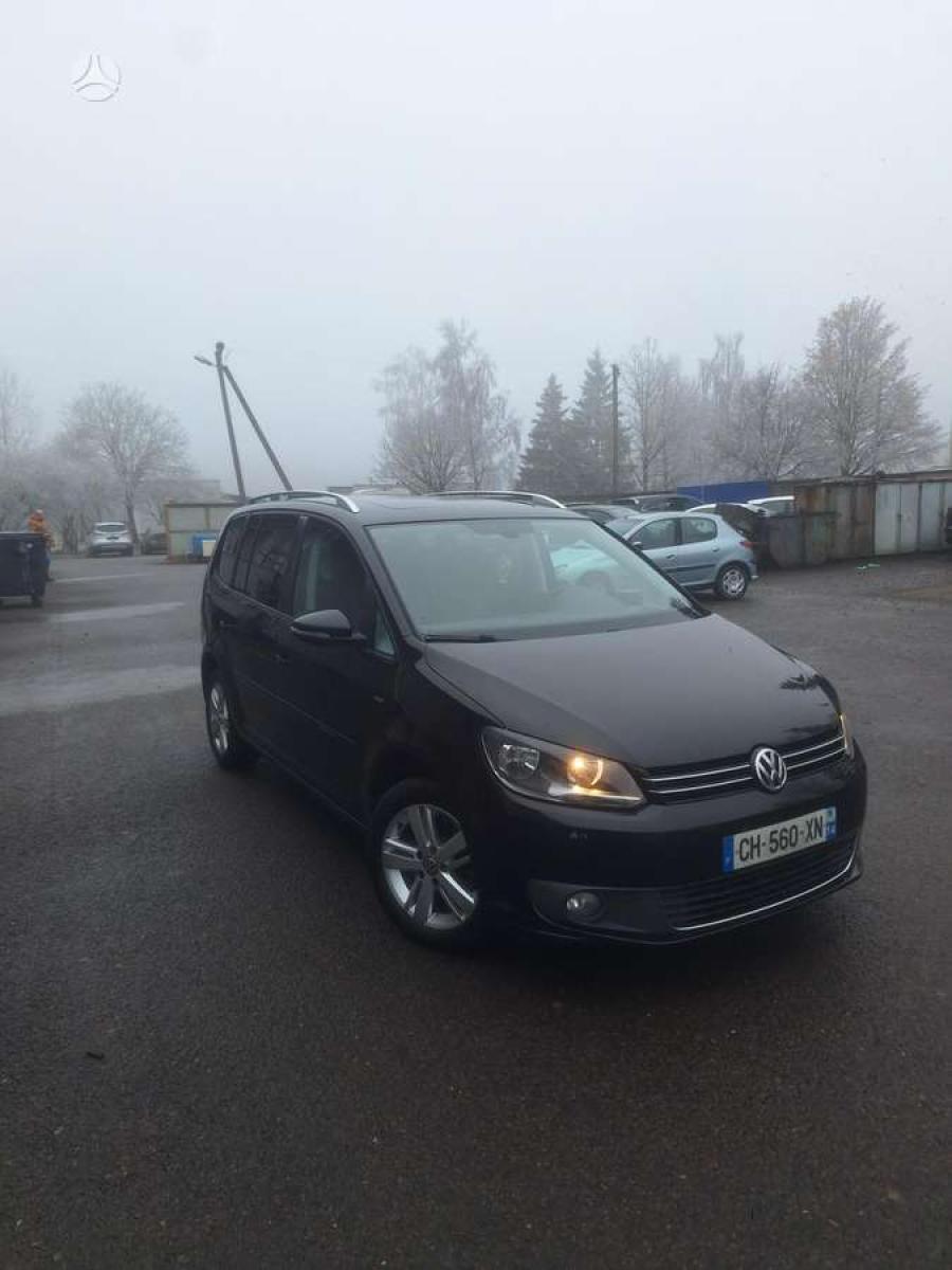 Black Volkswagen Touran 2012 in Vilnius, with an engine capacity of 1.97 L and mileage of 244 thousand km for 6650 €, photo 1 on AUTOMOTO.COM.LV