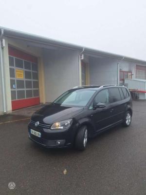 Black Volkswagen Touran 2012 in Vilnius, with an engine capacity of 1.97 L and mileage of 244 thousand km for 6650 €, photo 3 on AUTOMOTO.COM.LV