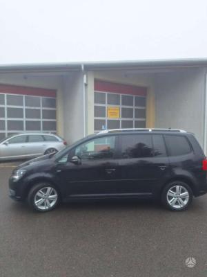 Black Volkswagen Touran 2012 in Vilnius, with an engine capacity of 1.97 L and mileage of 244 thousand km for 6650 €, photo 4 on AUTOMOTO.COM.LV