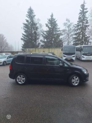 Black Volkswagen Touran 2012 in Vilnius, with an engine capacity of 1.97 L and mileage of 244 thousand km for 6650 €, photo 8 on AUTOMOTO.COM.LV
