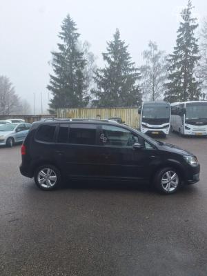 Black Volkswagen Touran 2012 in Vilnius, with an engine capacity of 2.00 L and mileage of 244 thousand km for 6650 €, photo 5 on AUTOMOTO.COM.LV