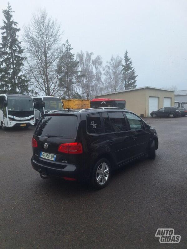 Black Volkswagen Touran 2012 in Vilnius, with an engine capacity of 2.00 L and mileage of 244 thousand km for 6650 €, photo 6 on AUTOMOTO.COM.LV
