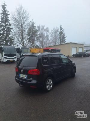 Black Volkswagen Touran 2012 in Vilnius, with an engine capacity of 2.00 L and mileage of 244 thousand km for 6650 €, photo 6 on AUTOMOTO.COM.LV