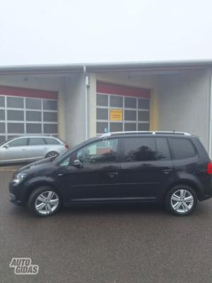 Black Volkswagen Touran 2012 in Vilnius, with an engine capacity of 2.00 L and mileage of 244 thousand km for 6650 €, photo 8 on AUTOMOTO.COM.LV