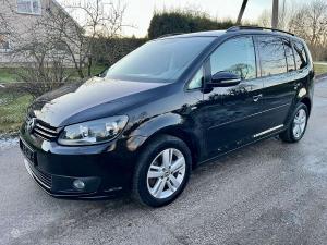 Black Volkswagen Touran 2012 in Kelme, with an engine capacity of 1.97 L and mileage of 366 thousand km for 5700 €, photo 3 on AUTOMOTO.COM.LV
