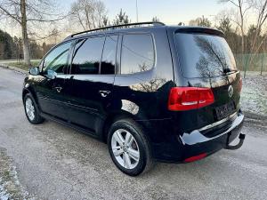 Black Volkswagen Touran 2012 in Kelme, with an engine capacity of 1.97 L and mileage of 366 thousand km for 5700 €, photo 4 on AUTOMOTO.COM.LV