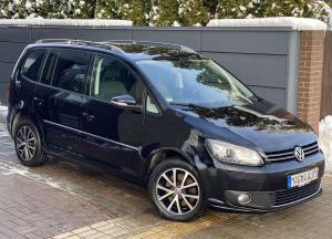 Black Volkswagen Touran 2012 in Marijampole, with an engine capacity of 1.97 L and mileage of 296 thousand km for 6750 €, photo 2 on AUTOMOTO.COM.LV