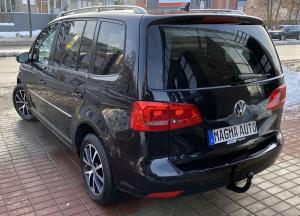 Black Volkswagen Touran 2012 in Marijampole, with an engine capacity of 1.97 L and mileage of 296 thousand km for 6750 €, photo 4 on AUTOMOTO.COM.LV