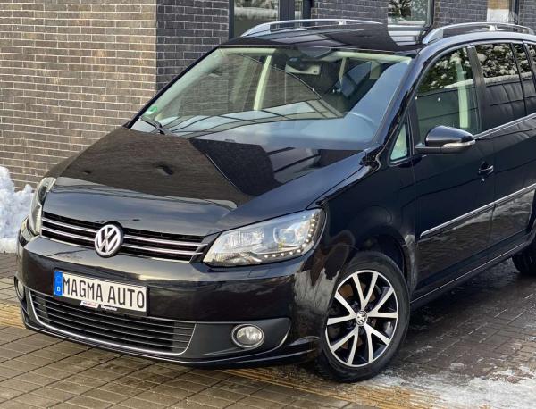 Black Volkswagen Touran 2012 in Marijampole, with an engine capacity of 1.97 L and mileage of 296 thousand km for 6750 €, photo 7 on AUTOMOTO.COM.LV
