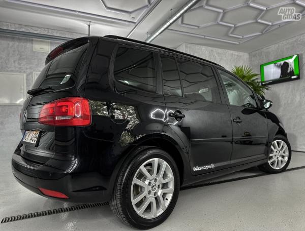 Black Volkswagen Touran 2012 in Kaunas, with an engine capacity of 2.00 L and mileage of 314 thousand km for 5350 €, photo 7 on AUTOMOTO.COM.LV