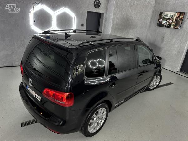 Black Volkswagen Touran 2012 in Kaunas, with an engine capacity of 2.00 L and mileage of 314 thousand km for 5350 €, photo 8 on AUTOMOTO.COM.LV