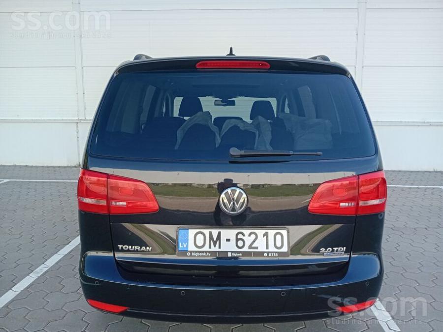 Black Volkswagen Touran 2012 in Riga, with an engine capacity of 2.00 L and mileage of 183 thousand km for 6780 €, photo 6 on AUTOMOTO.COM.LV