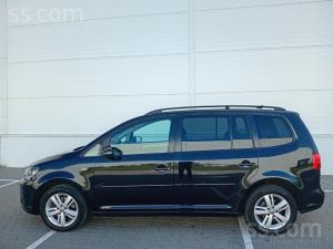 Black Volkswagen Touran 2012 in Riga, with an engine capacity of 2.00 L and mileage of 183 thousand km for 6780 €, photo 9 on AUTOMOTO.COM.LV