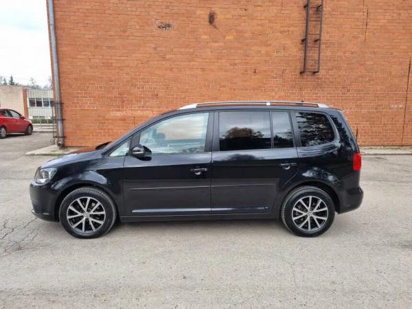 Black Volkswagen Touran 2012 in Jekabpils, with an engine capacity of 1.60 L and mileage of 261 thousand km for 6650 €, photo 10 on AUTOMOTO.COM.LV