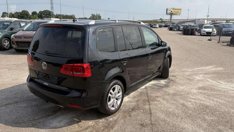 Black Volkswagen Touran 2012 in Marijampole, with an engine capacity of 1.97 L and mileage of 246 thousand km for 6000 €, photo 4 on AUTOMOTO.COM.LV