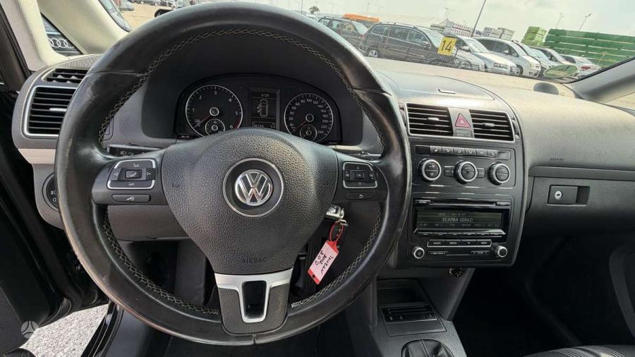 Black Volkswagen Touran 2012 in Marijampole, with an engine capacity of 1.97 L and mileage of 246 thousand km for 6000 €, photo 29 on AUTOMOTO.COM.LV