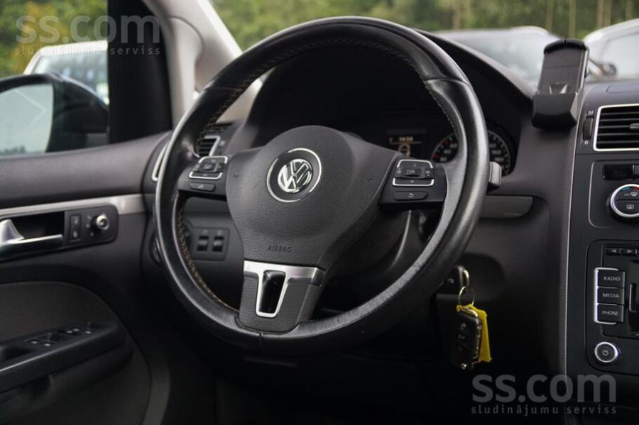 Black Volkswagen Touran 2012 in Riga, with an engine capacity of 1.40 L and mileage of 176 thousand km for 6990 €, photo 14 on AUTOMOTO.COM.LV