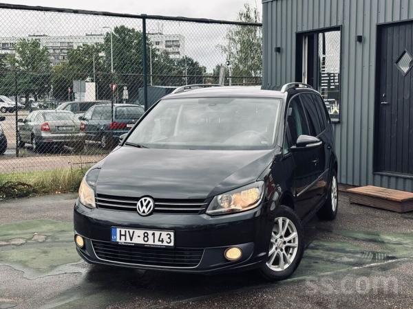 Black Volkswagen Touran 2012 in Riga, with an engine capacity of 2.00 L and mileage of 267 thousand km for 4990 €, photo 1 on AUTOMOTO.COM.LV