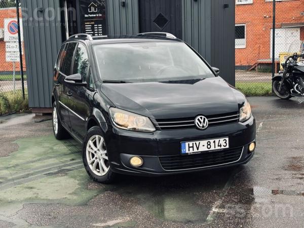 Black Volkswagen Touran 2012 in Riga, with an engine capacity of 2.00 L and mileage of 267 thousand km for 4990 €, photo 3 on AUTOMOTO.COM.LV