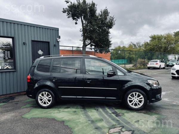 Black Volkswagen Touran 2012 in Riga, with an engine capacity of 2.00 L and mileage of 267 thousand km for 4990 €, photo 6 on AUTOMOTO.COM.LV