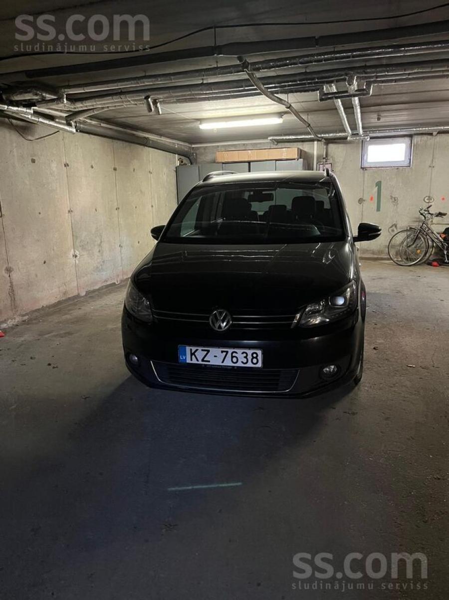 Black Volkswagen Touran 2013 in Riga, with an engine capacity of 2.00 L and mileage of 321 thousand km for 6499 €, photo 1 on AUTOMOTO.COM.LV
