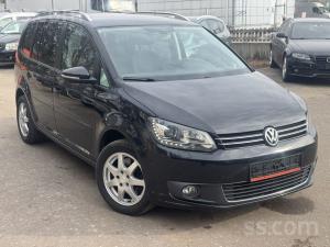 Black Volkswagen Touran 2013 in Riga, with an engine capacity of 1.40 L and mileage of 225 thousand km for 6950 €, photo 5 on AUTOMOTO.COM.LV