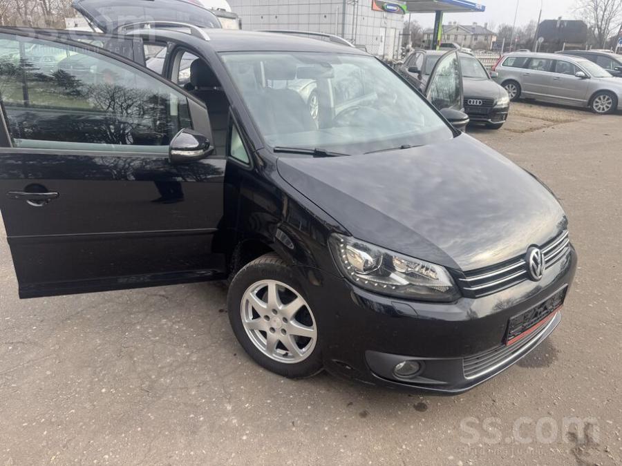 Black Volkswagen Touran 2013 in Riga, with an engine capacity of 1.40 L and mileage of 225 thousand km for 6950 €, photo 8 on AUTOMOTO.COM.LV