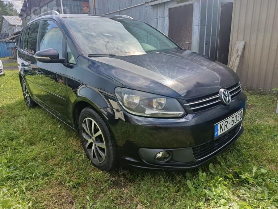 Black Volkswagen Touran 2013 in Riga, with an engine capacity of 2.00 L and mileage of 300 thousand km for 3800 €, photo 1 on AUTOMOTO.COM.LV