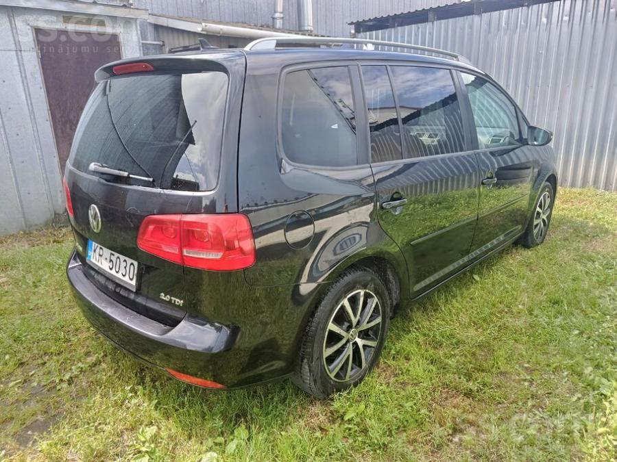 Black Volkswagen Touran 2013 in Riga, with an engine capacity of 2.00 L and mileage of 300 thousand km for 3800 €, photo 5 on AUTOMOTO.COM.LV