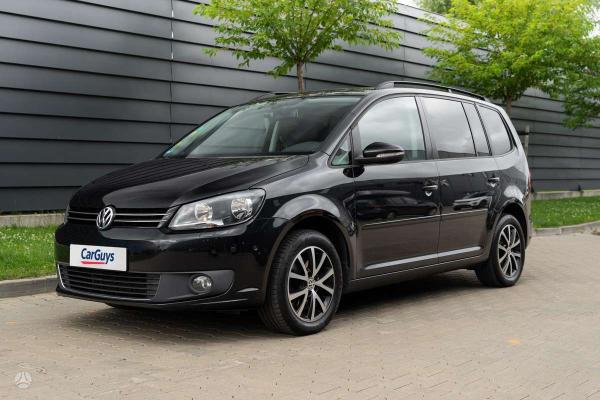 Black Volkswagen Touran 2013 in Vilnius, with an engine capacity of 1.39 L and mileage of 219 thousand km for 6600 €, photo 1 on AUTOMOTO.COM.LV