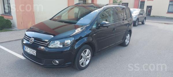 Black Volkswagen Touran 2013 in Riga, with an engine capacity of 2.00 L and mileage of 352 thousand km for 5300 €, photo 2 on AUTOMOTO.COM.LV
