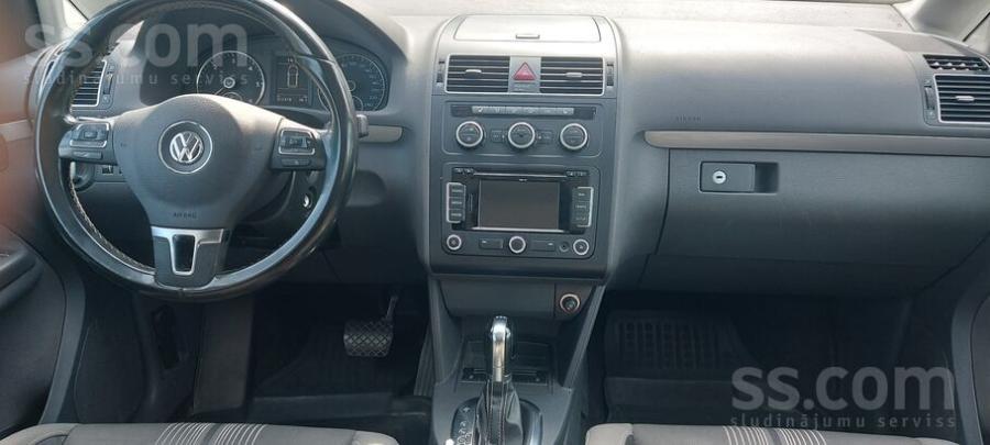 Black Volkswagen Touran 2013 in Riga, with an engine capacity of 2.00 L and mileage of 352 thousand km for 5300 €, photo 7 on AUTOMOTO.COM.LV