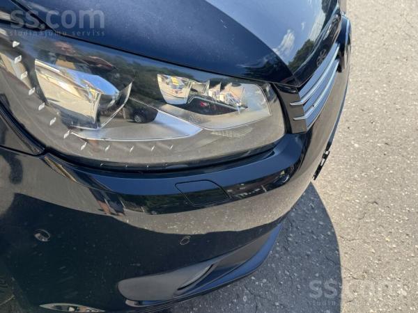 Black Volkswagen Touran 2013 in Riga, with an engine capacity of 1.40 L and mileage of 225 thousand km for 7850 €, photo 8 on AUTOMOTO.COM.LV