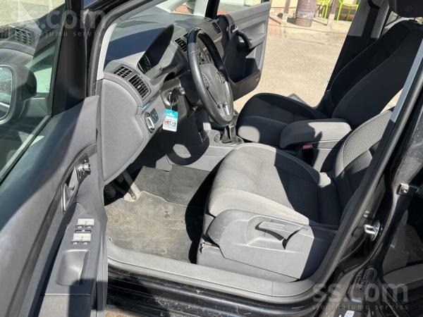 Black Volkswagen Touran 2013 in Riga, with an engine capacity of 1.40 L and mileage of 225 thousand km for 7850 €, photo 9 on AUTOMOTO.COM.LV