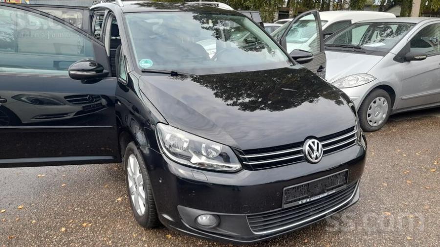 Black Volkswagen Touran 2014 in Riga, with an engine capacity of 1.20 L and mileage of 220 thousand km for 6500 €, photo 30 on AUTOMOTO.COM.LV