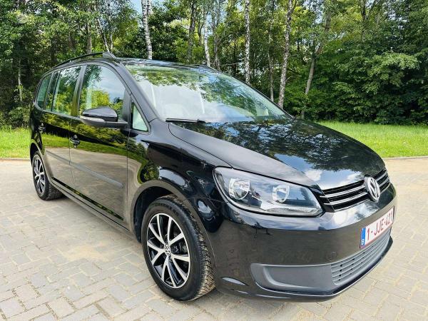 Black Volkswagen Touran 2015 in Kaunas, with an engine capacity of 1.60 L and mileage of 242 thousand km for 7100 €, photo 1 on AUTOMOTO.COM.LV