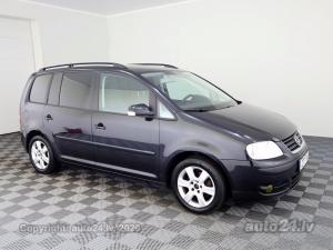 Black Volkswagen Touran 2006 in Tallinn, with an engine capacity of 2.00 L and mileage of 298 thousand km for 1199 €, photo  on AUTOMOTO.COM.LV