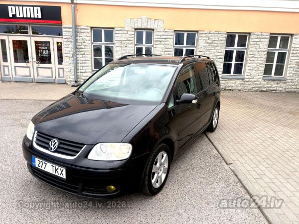 Black Volkswagen Touran 2006 in Tallinn, with an engine capacity of 2.00 L and mileage of 390 thousand km for 1899 €, photo 3 on AUTOMOTO.COM.LV