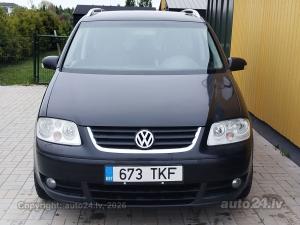 Black Volkswagen Touran 2006 in Tartu, with an engine capacity of 2.00 L and mileage of 300 thousand km for 1990 €, photo 3 on AUTOMOTO.COM.LV